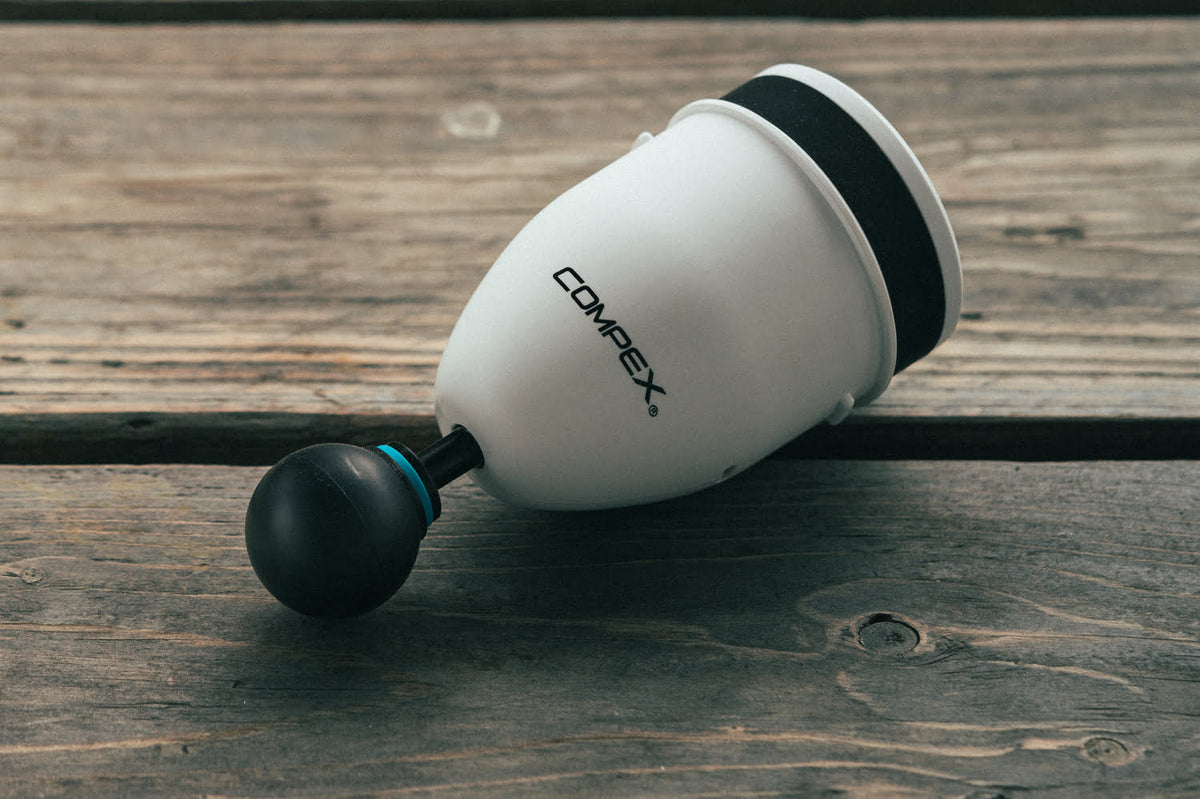 Alivia dolores y mejora tu bienestar con la mini Pistola de masajes co – Compex